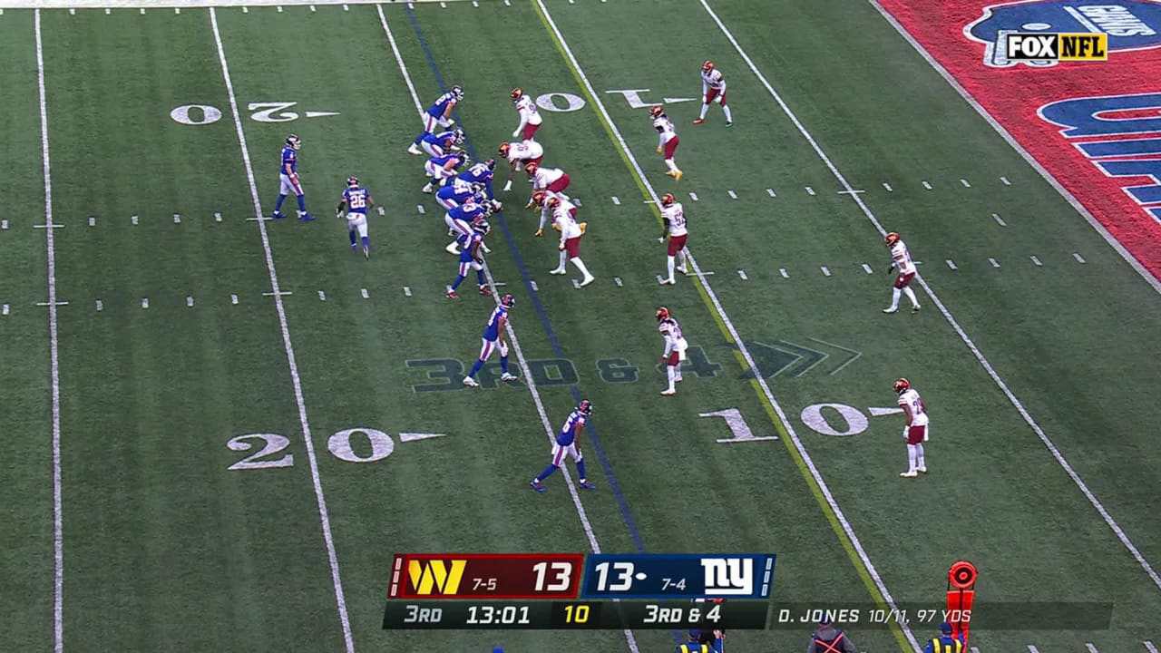 New York Giants quarterback Daniel Jones hesitates and accelerates for ...