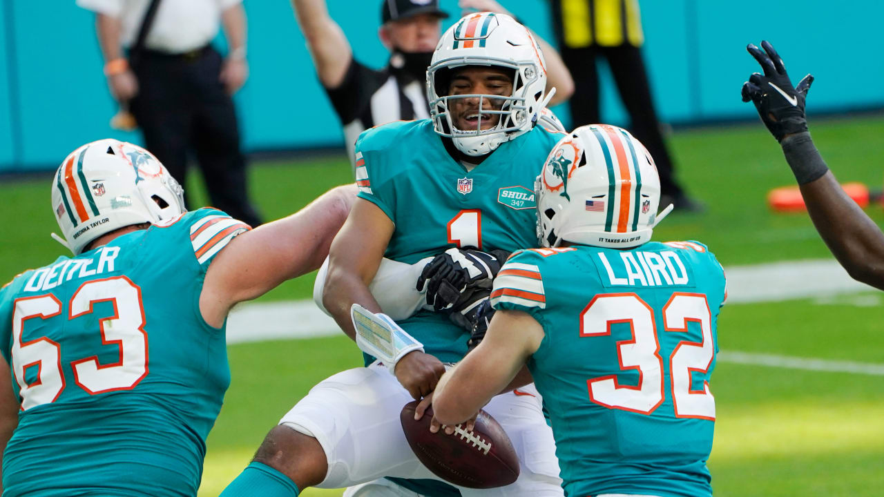 Miami Dolphins quarterback Tua Tagovailoa burrows in for his second TD run