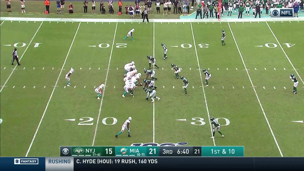Fitzmagic fits a laser throw between three defenders