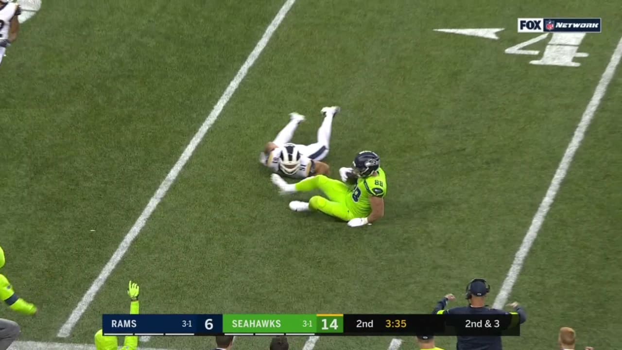 Russell Wilson drops perfect pass to Will Dissly for over-the-shoulder ...