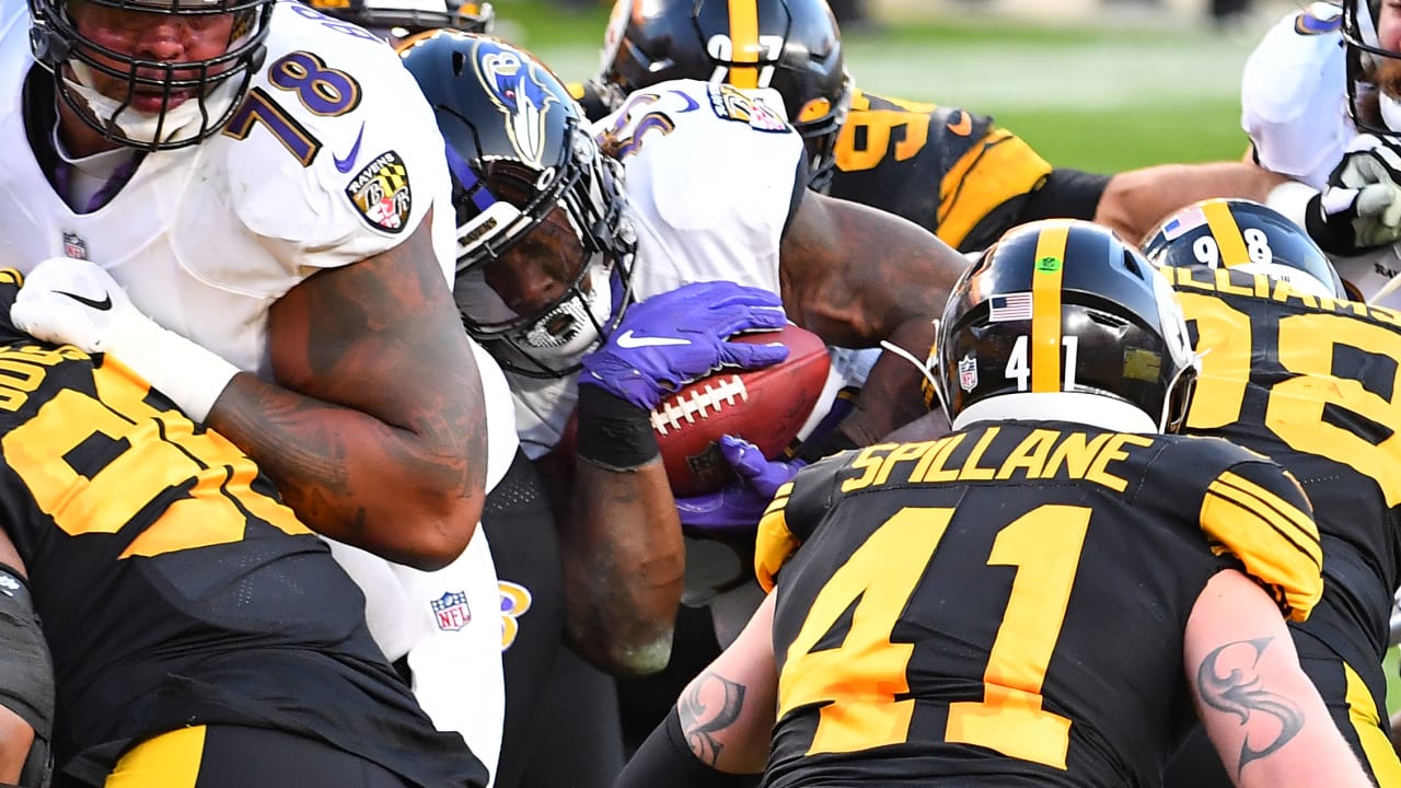 Baltimore Ravens running back Gus Edwards plows into the end zone for ...