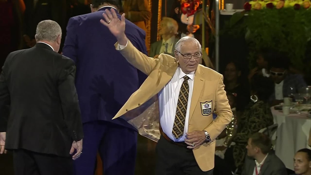 Former NFL safety Johnny Robinson receives his Hall of Fame gold jacket