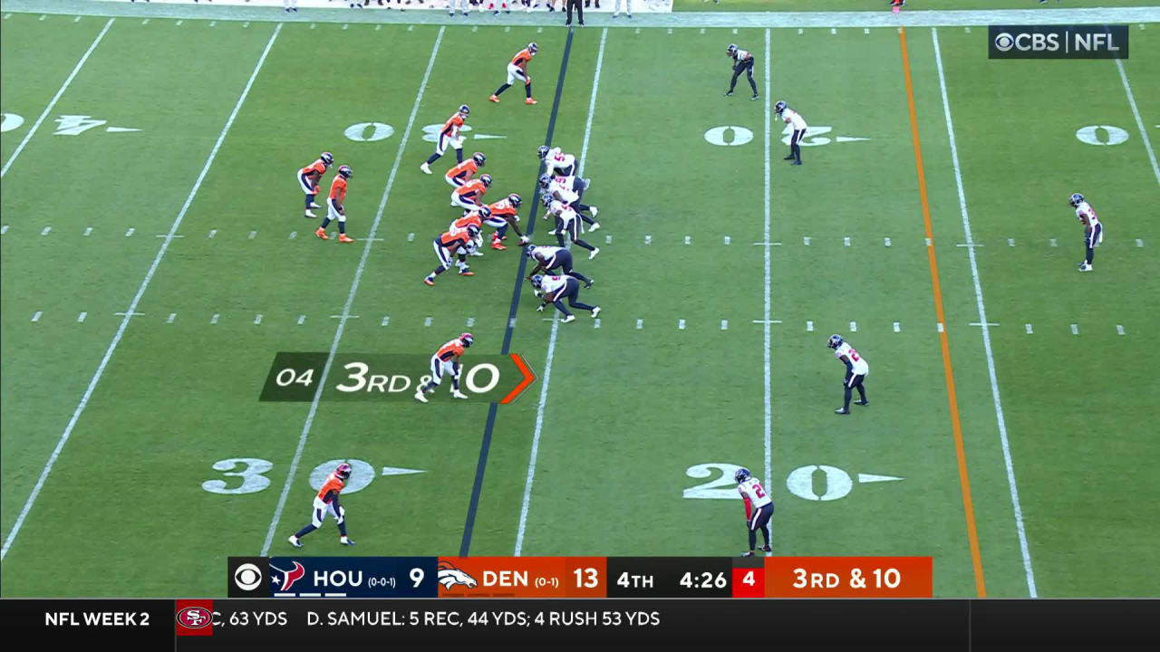 Denver Broncos quarterback Russell Wilson trips over his own feet on ...