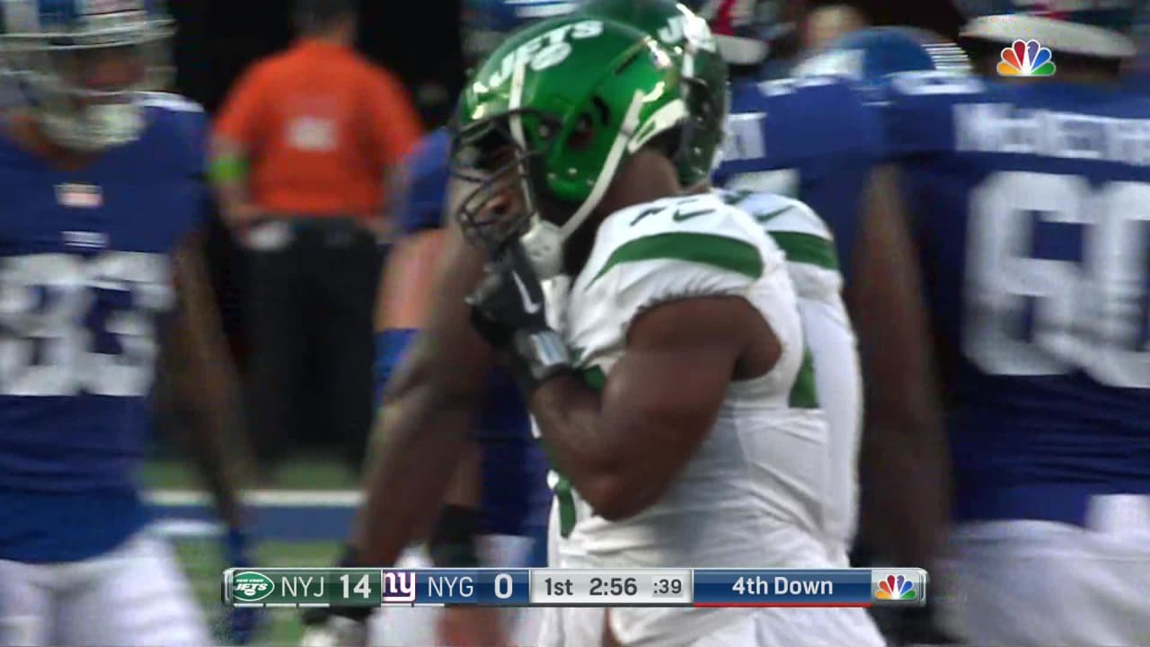 Pocket collapses on Tommy DeVito as New York Jets defensive end Bryce Huff gets the sack