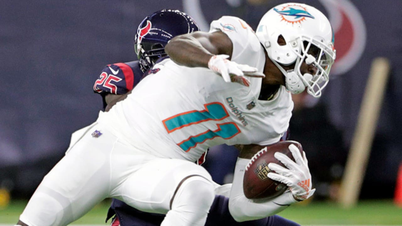 DeVante Parker reaches backwards to catch laser pass