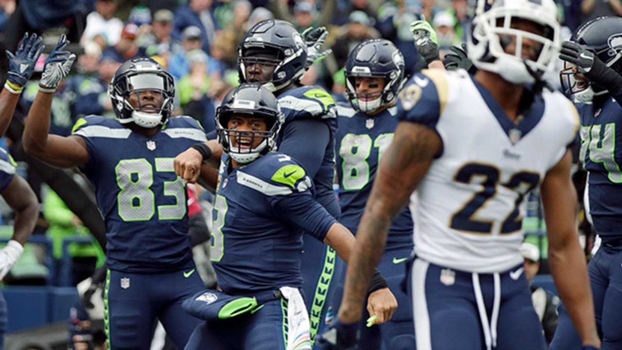 Wilson buys time, finds David Moore for TD