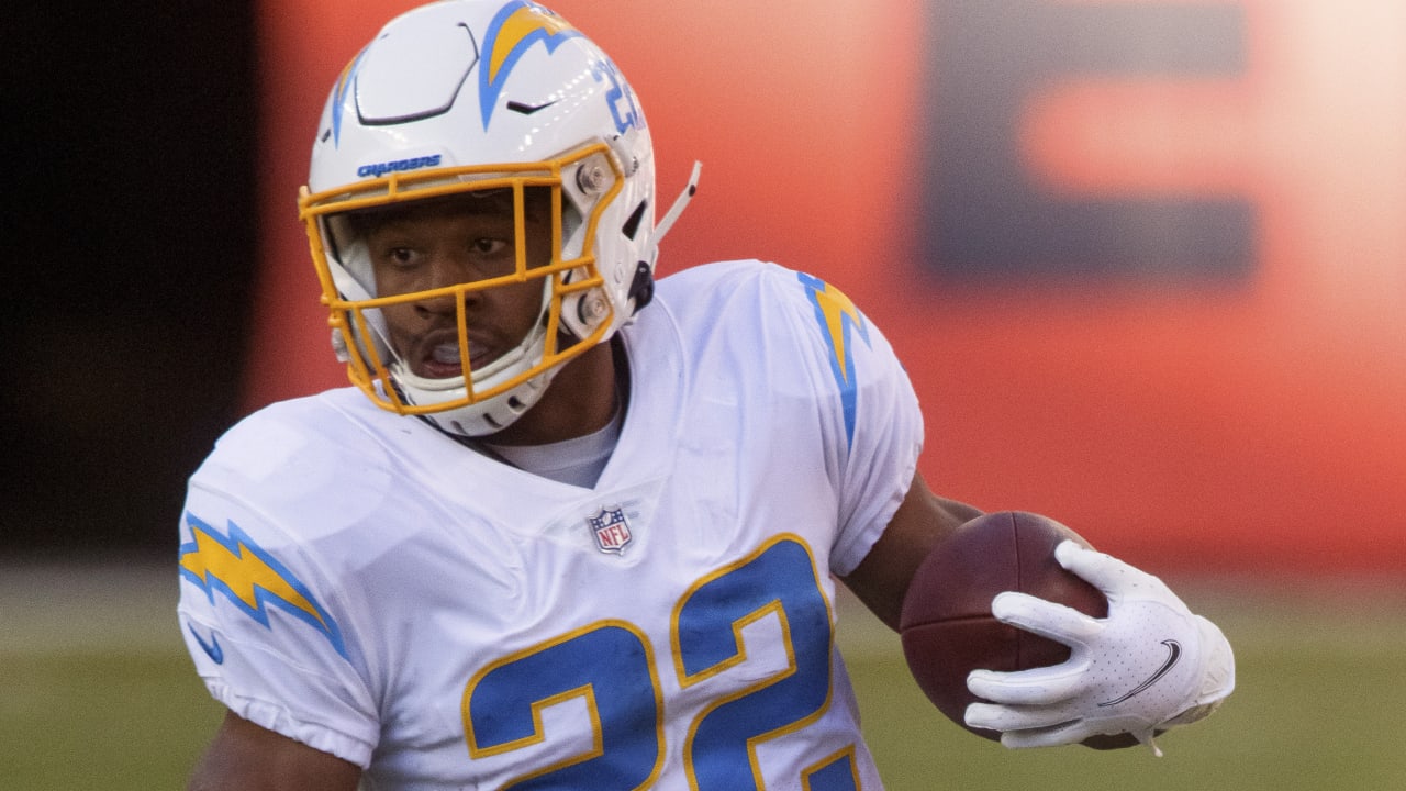 Los Angeles Chargers running back Justin Jackson weaves through Broncos ...