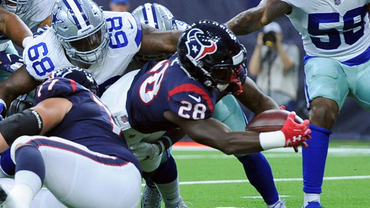 Alfred Blue bulldozes through the offense for a 4-yard touchdown