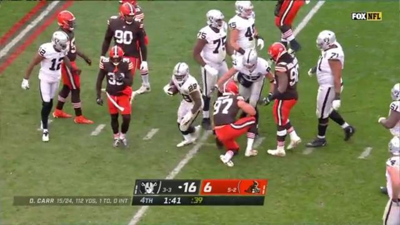 Las Vegas Raiders running back Josh Jacobs hurdles his teammate, cuts ...