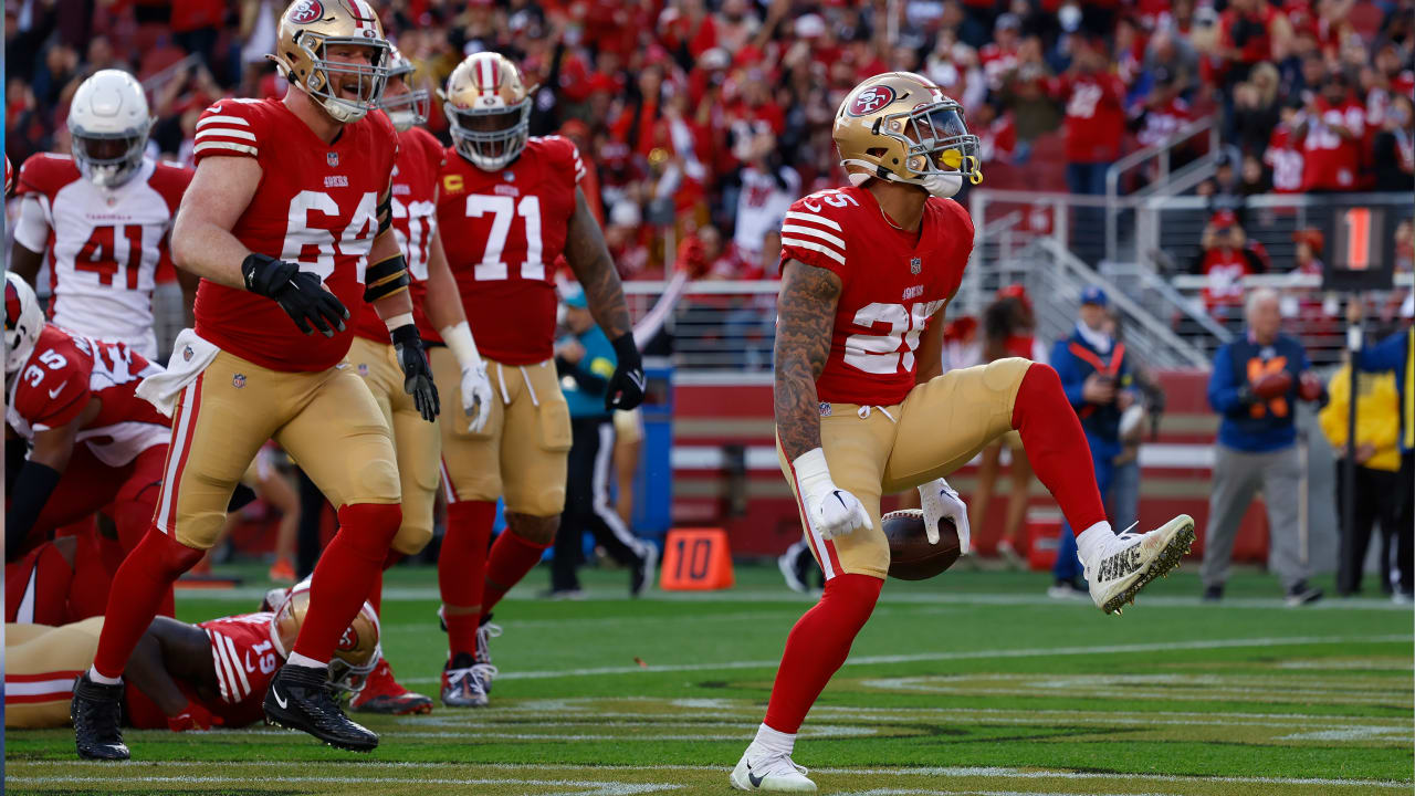 San Francisco 49ers running back Elijah Mitchell follows blockers for ...