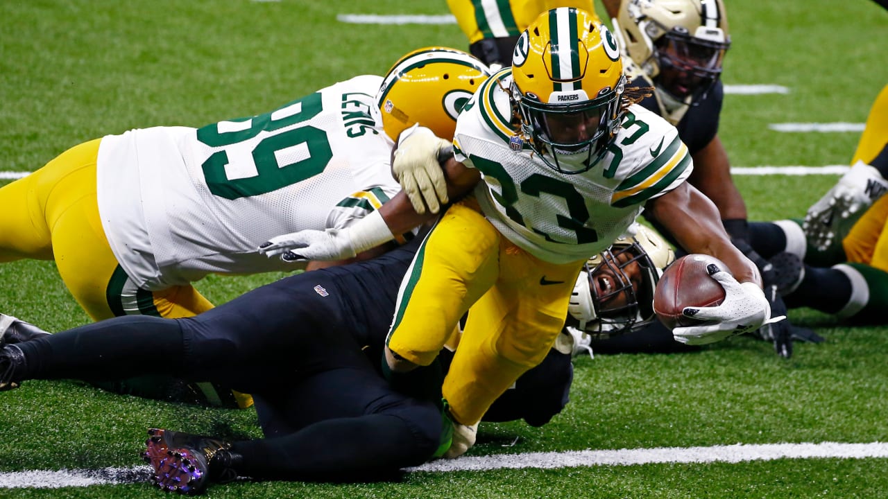 Green Bay Packers running back Aaron Jones slips under New Orleans ...