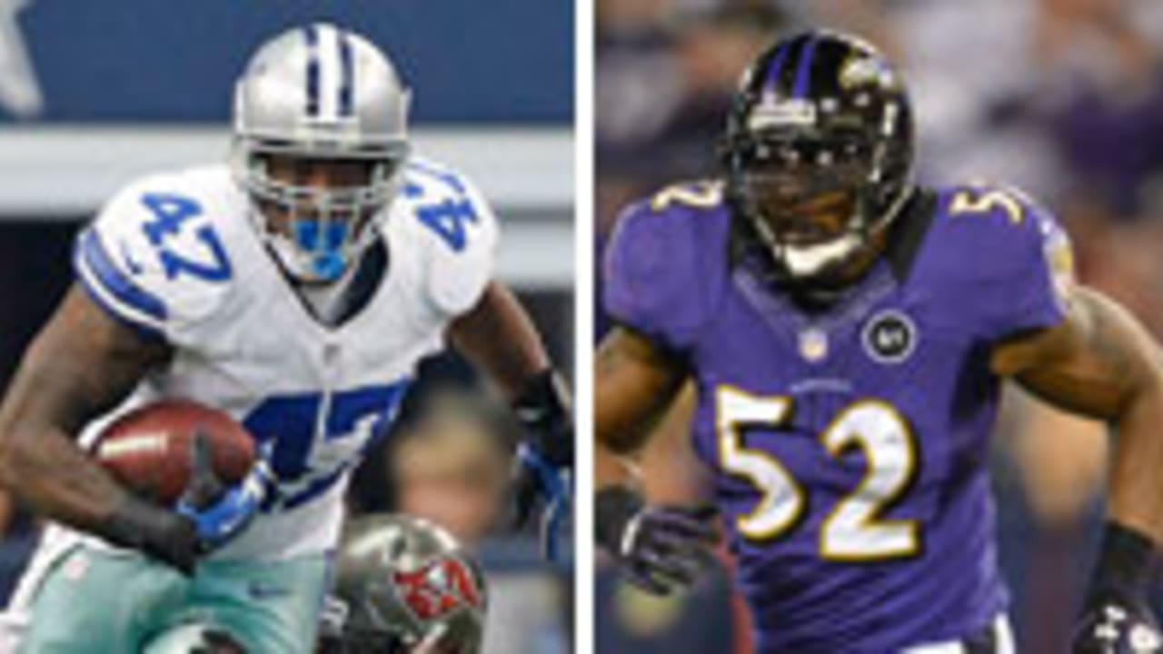 Cowboys' Lawrence Vickers takes on Ravens' Ray Lewis