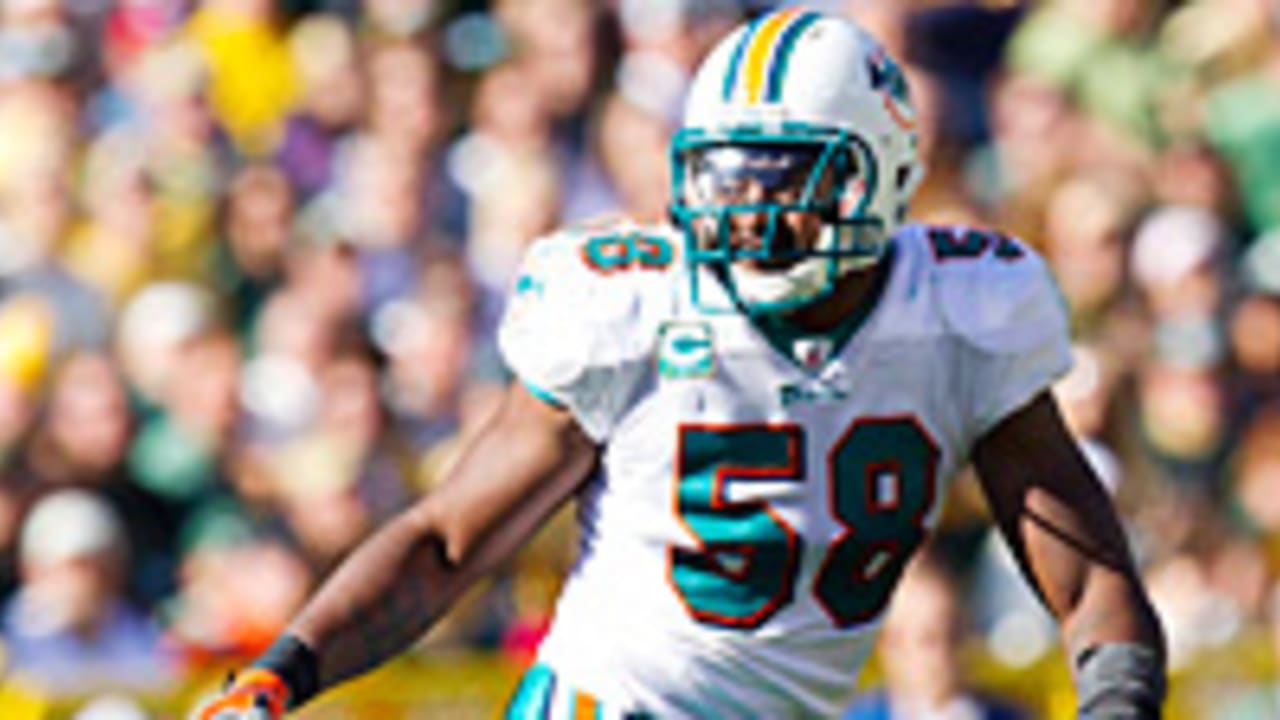 Karlos Dansby out after Dolphins add Dannell Ellerbe