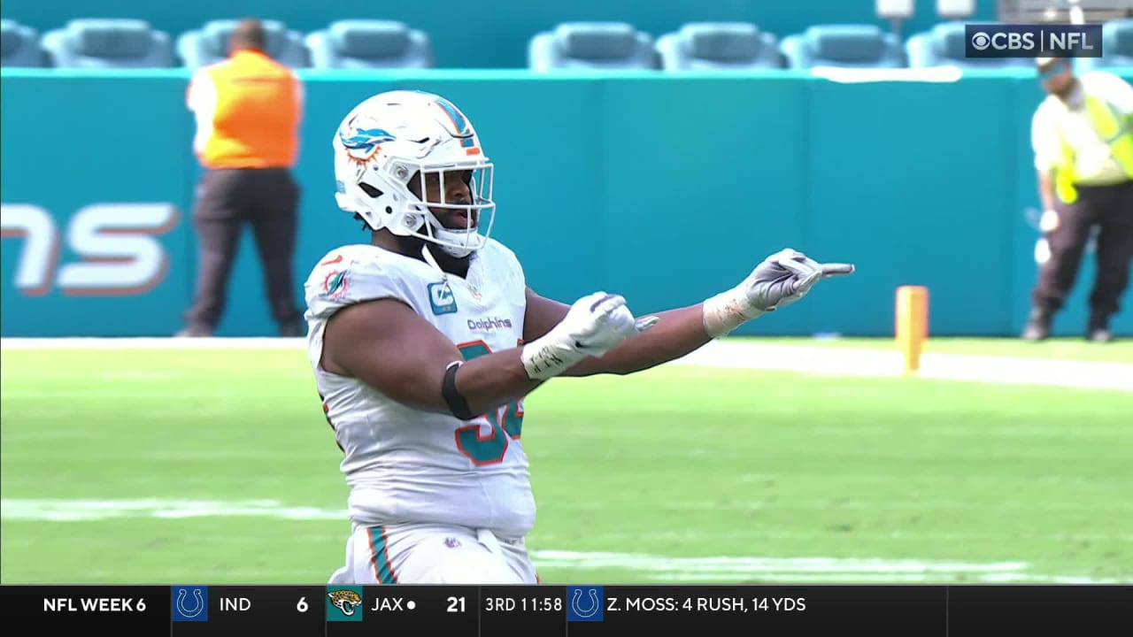 Miami Dolphins defensive tackle Christian Wilkins ambushes Carolina Panthers quarterback Bryce ...