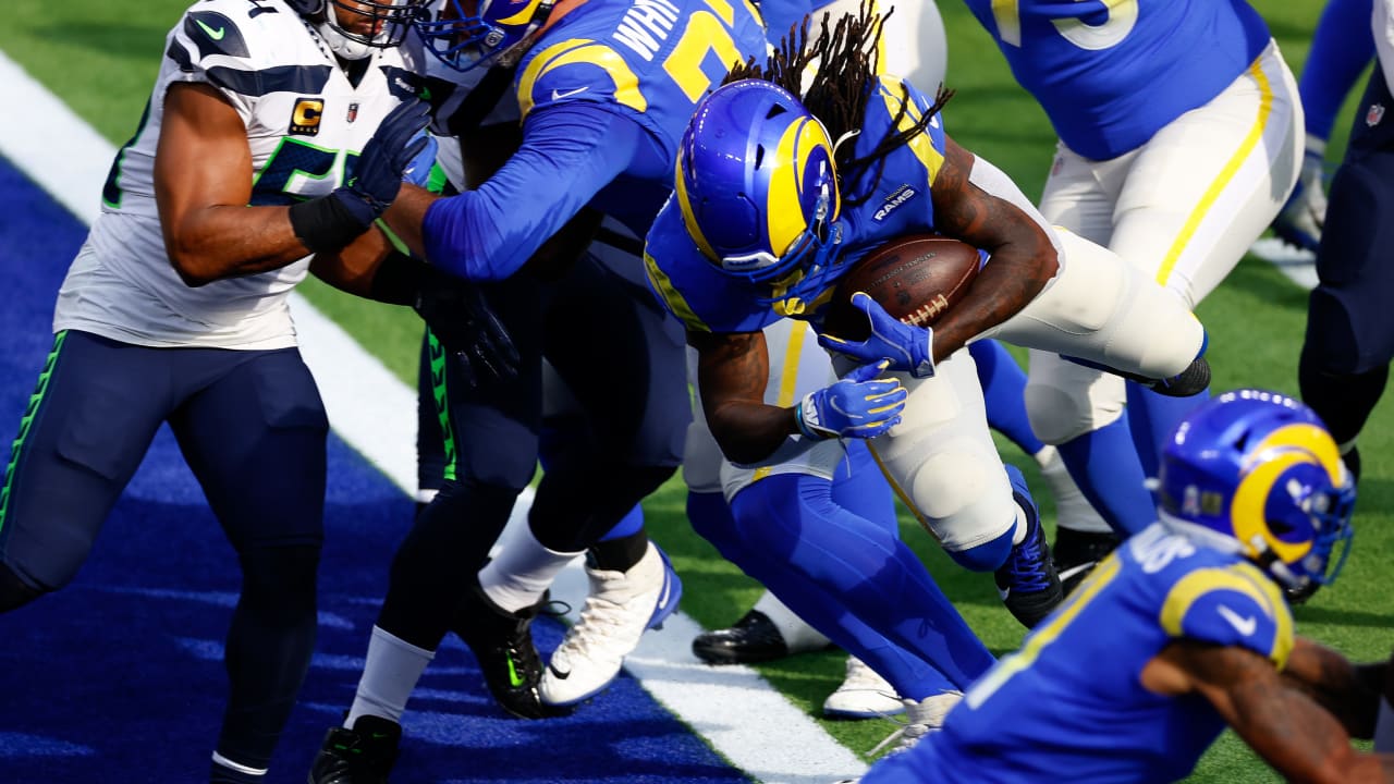 Los Angeles Rams running back Darrell Henderson slices off the edge for ...