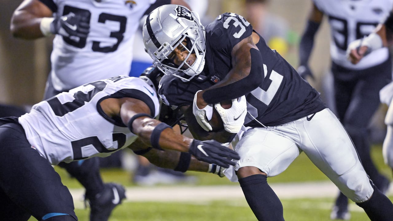 Las Vegas Raiders running back Austin Walter follows convoy of blockers ...