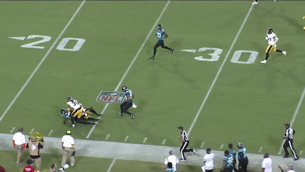 Jacksonville Jaguars wide receiver Tim Jones evades multiple defenders ...