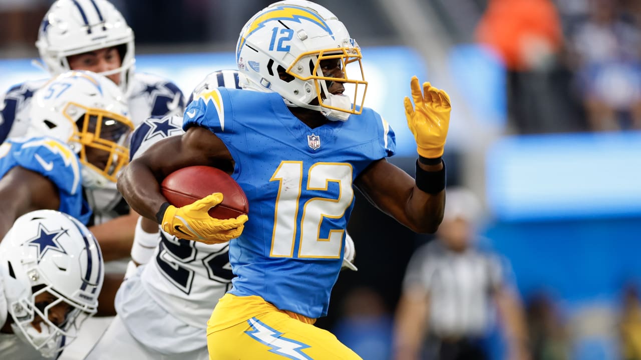 Los Angeles Chargers wide receiver Derius Davis speeds around the edge ...