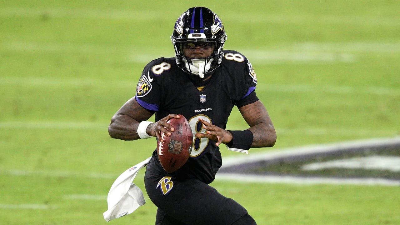 Baltimore Ravens quarterback Lamar Jackson's left-handed reach keeps ...