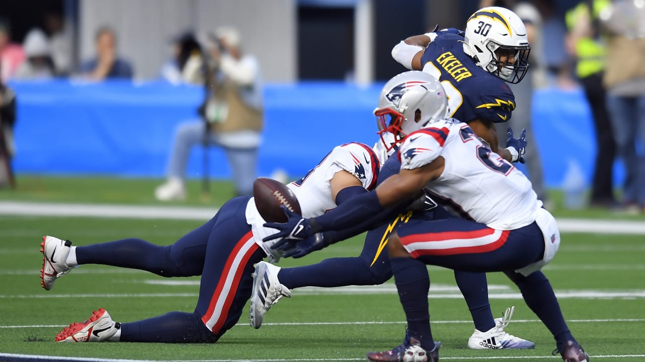 New England Patriots defensive back Adrian Phillips swipes a deflected ...