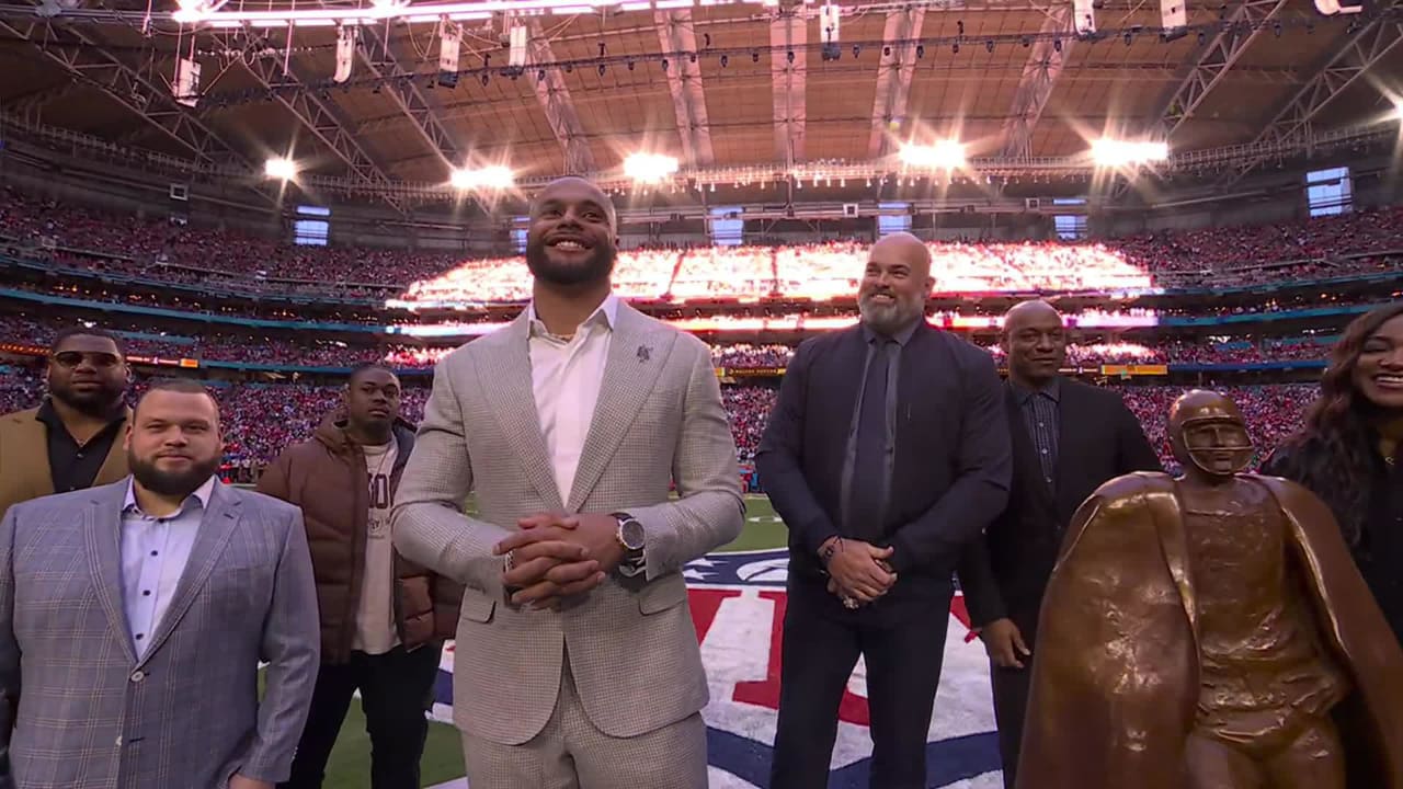 Former player Andrew Whitworth presents Dallas Cowboys quarterback Dak ...