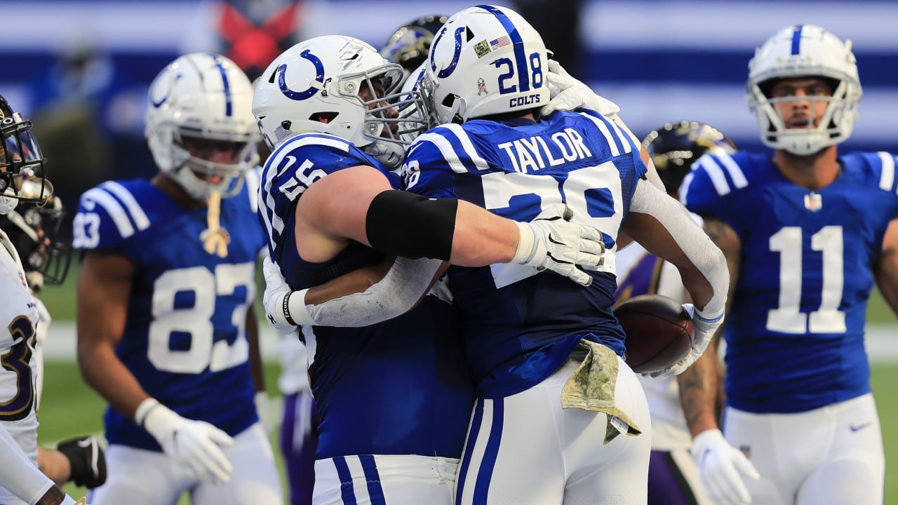 Indianapolis Colts running back Jonathan Taylor propels over the pile ...