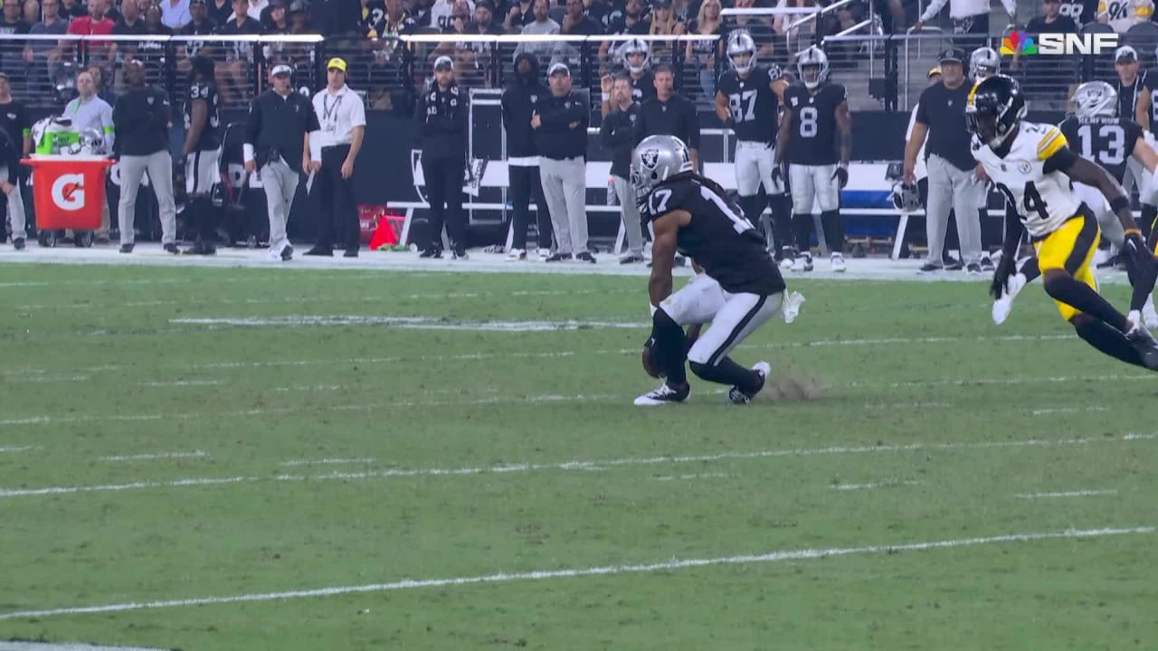 Las Vegas Raiders wide receiver Davante Adams scoops a low throw with ...