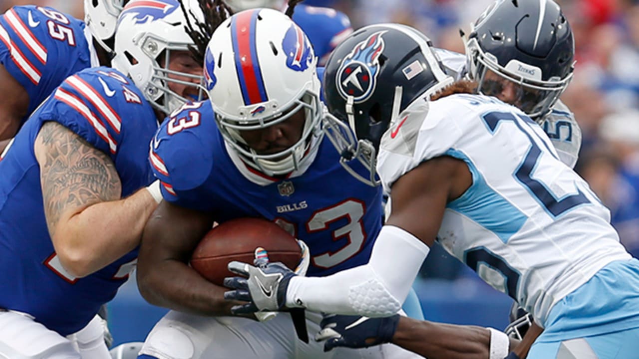 Ivory refuses to go down with defenders draped all over him