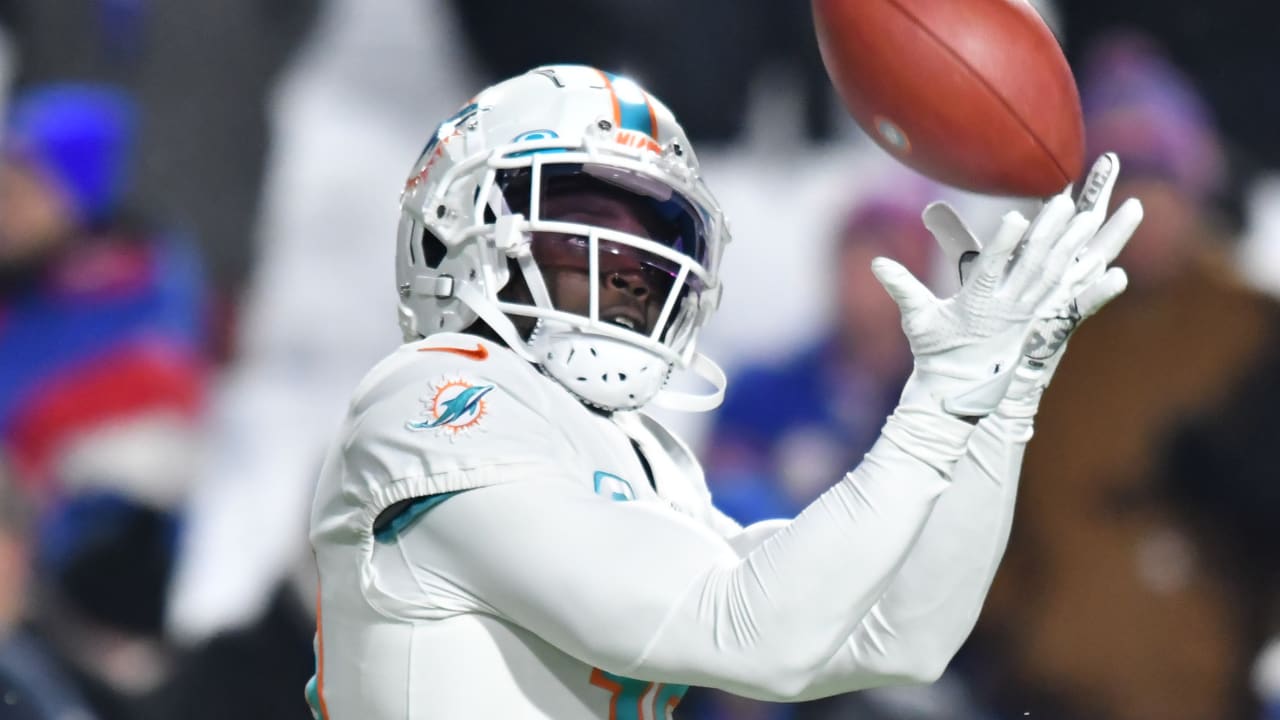 Miami Dolphins wide receiver Tyreek Hill high points a 15-yard grab against two defenders