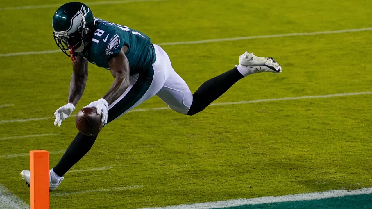 Philadelphia Eagles wide receiver Jalen Reagor bounces along the goal ...
