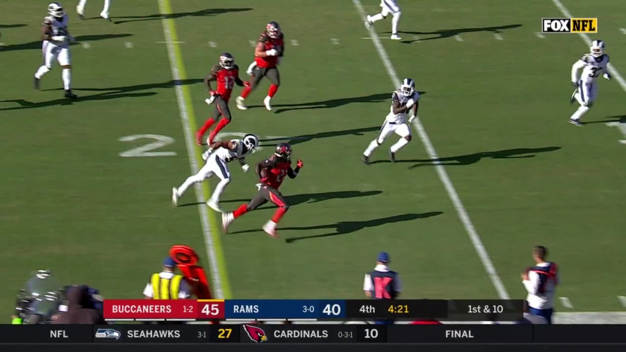 Ronald Jones revs up and runs by host of Rams defenders for 24 yards