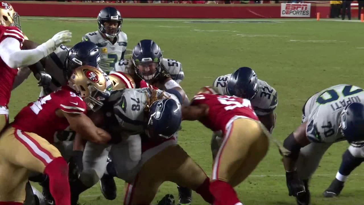 Chris Carson careens over Niners' DL for strong TD