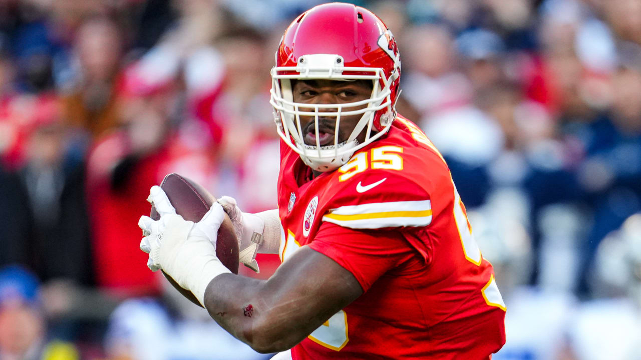 Kansas City Chiefs defensive end Chris Jones attempts to run back ...