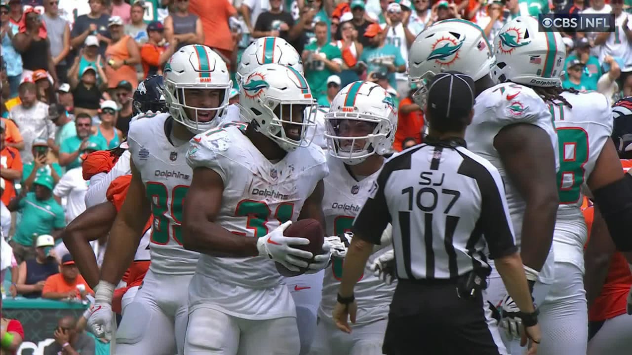 Miami Dolphins running back Raheem Mostert plows in on fourth down for his third TD of the day