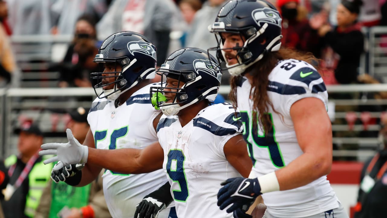 Seattle Seahawks running back Kenneth Walker III dashes past defenders ...