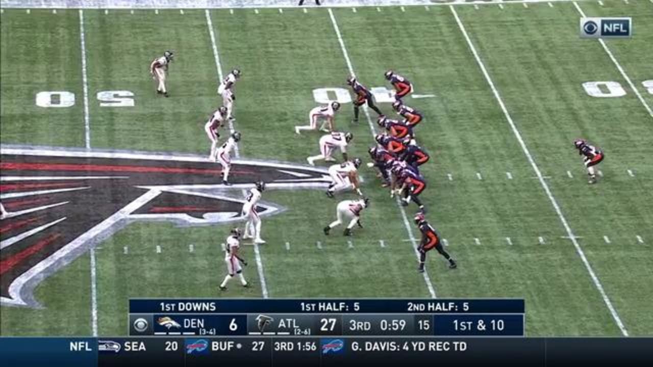 Denver Broncos quarterback Drew Lock lofts cross-body dart to jumping wide receiver Jerry Jeudy ...