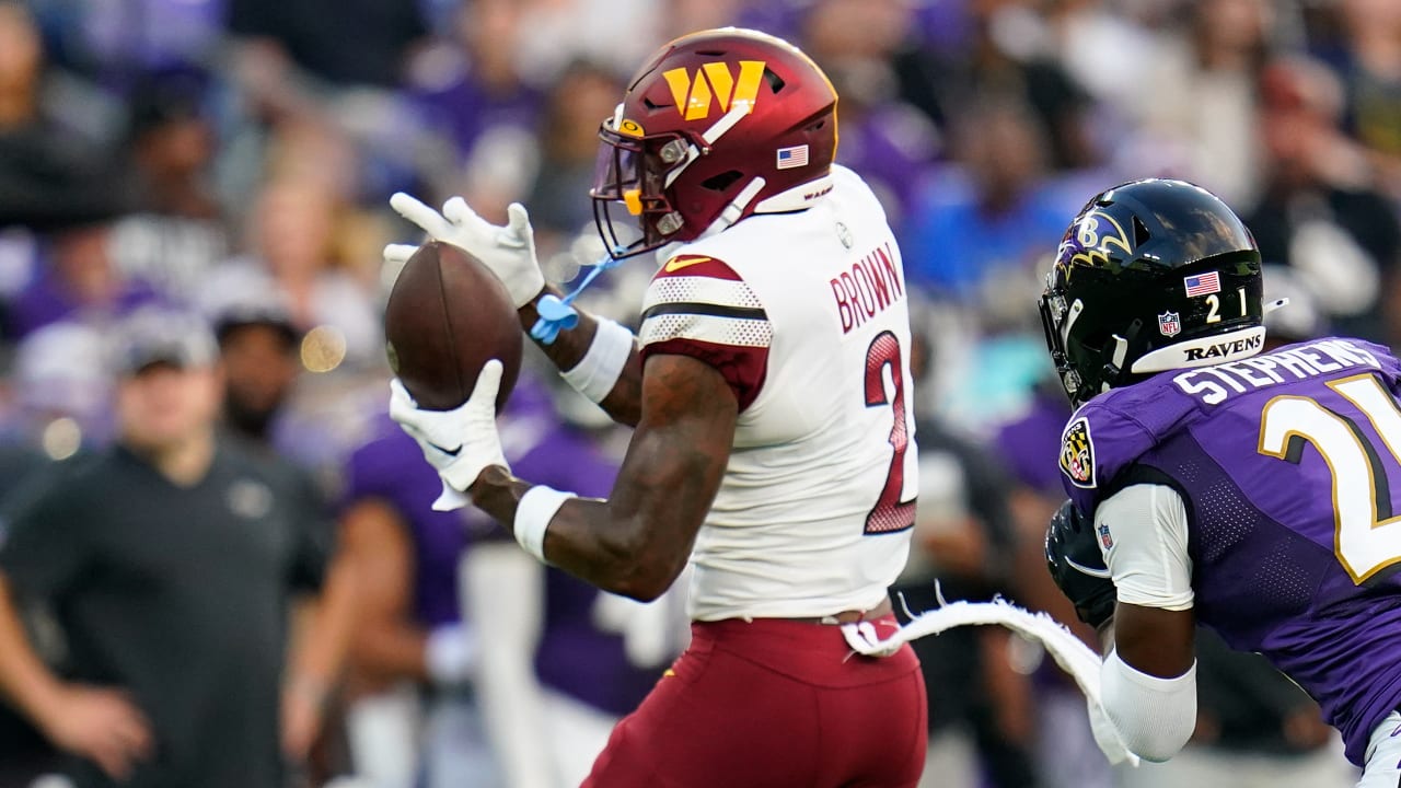 Washington Commanders quarterback Sam Howell and wide receiver Dyami ...