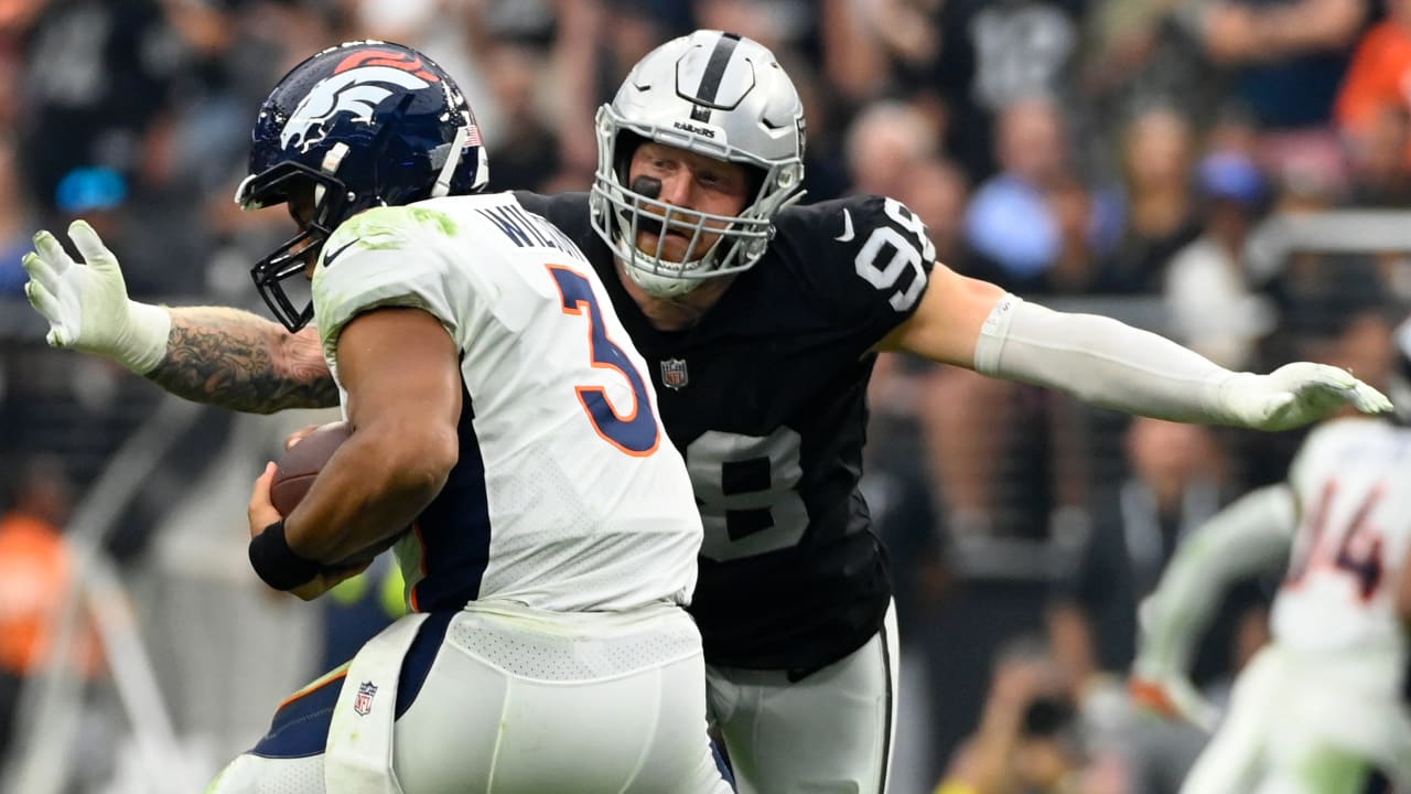 Las Vegas Raiders defensive end Maxx Crosby ambushes Denver Broncos quarterback Russell Wilson ...
