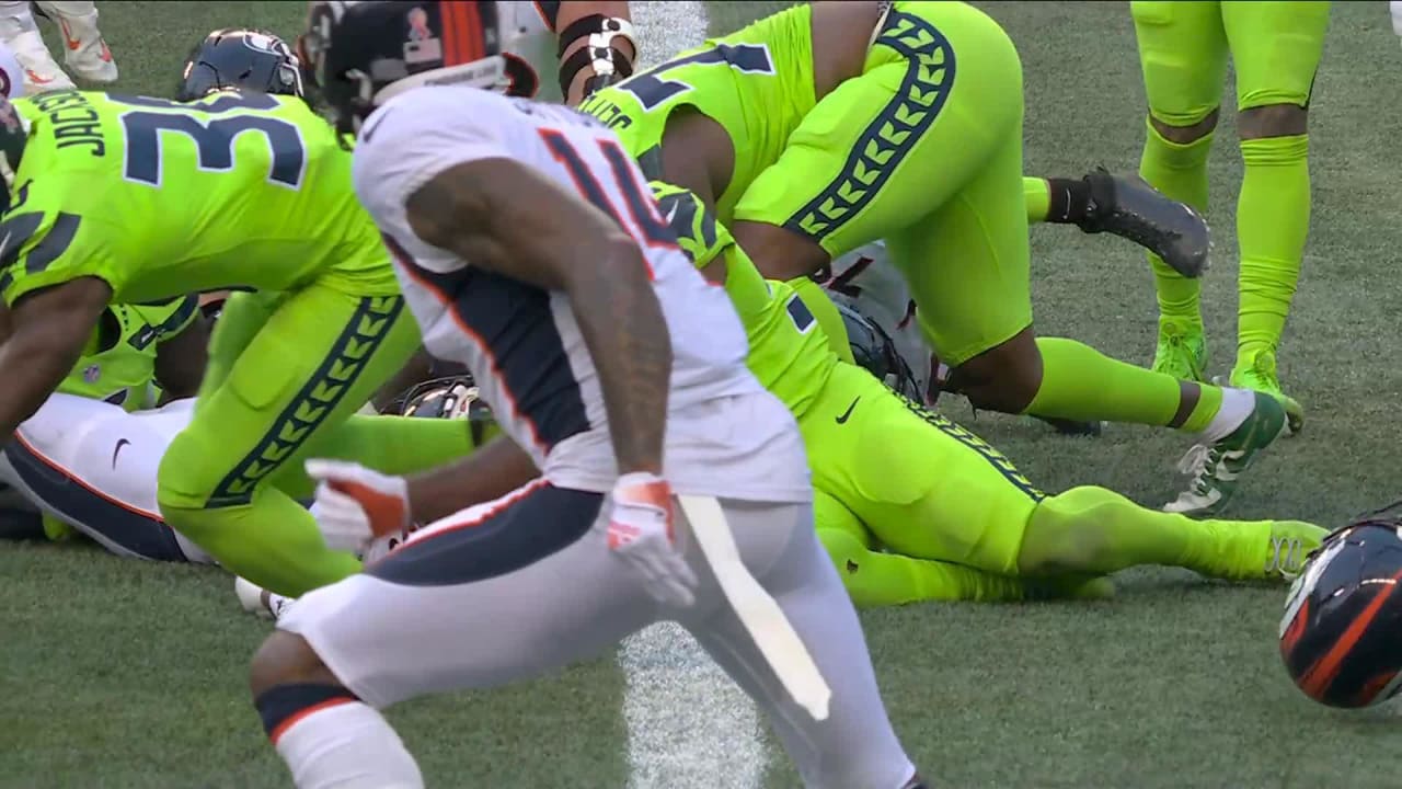Seattle Seahawks converge to force Denver Broncos running back Melvin ...