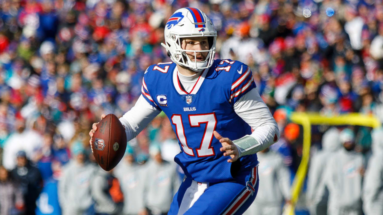 Buffalo Bills quarterback Josh Allen reaches out to move the chains on ...