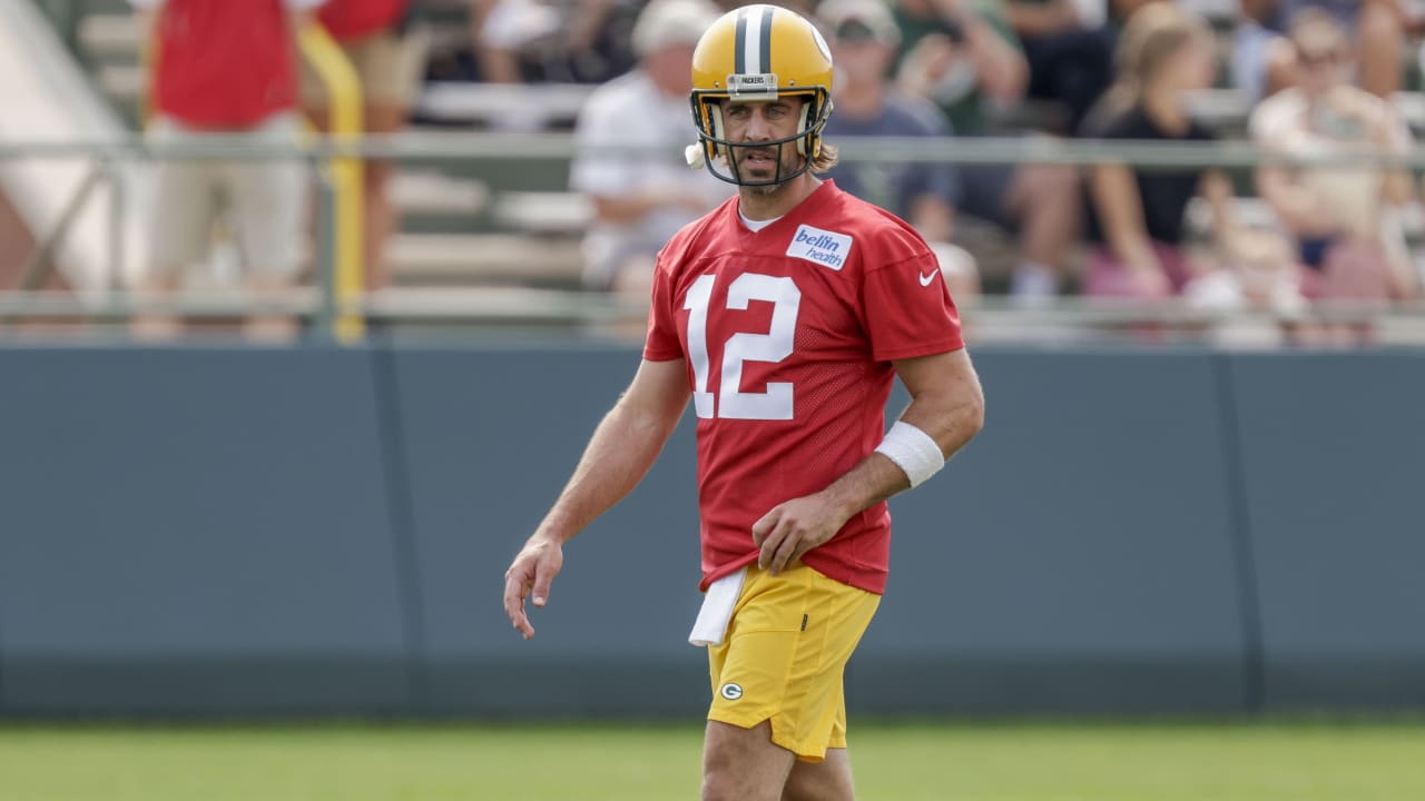 Green Bay Packers quarterback Aaron Rodgers takes the field at training ...