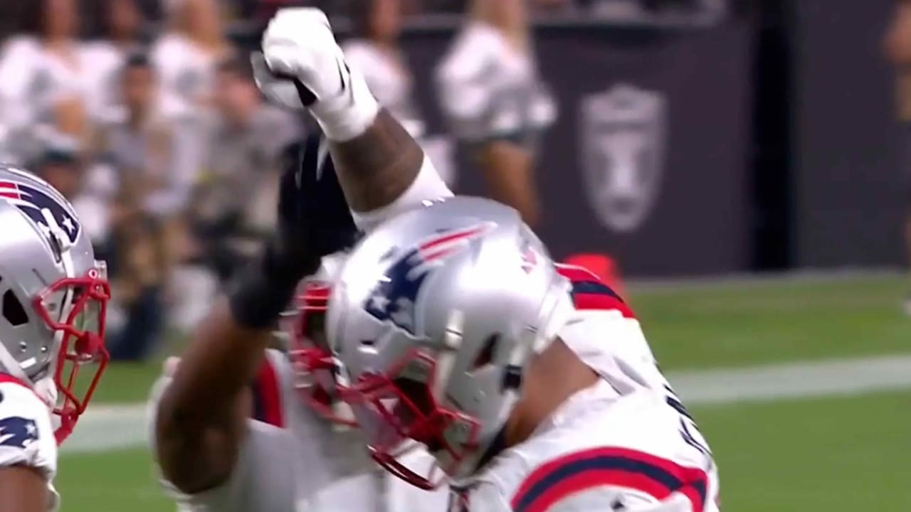 New England Patriots defensive lineman Daniel Ekuale loops around for a ...