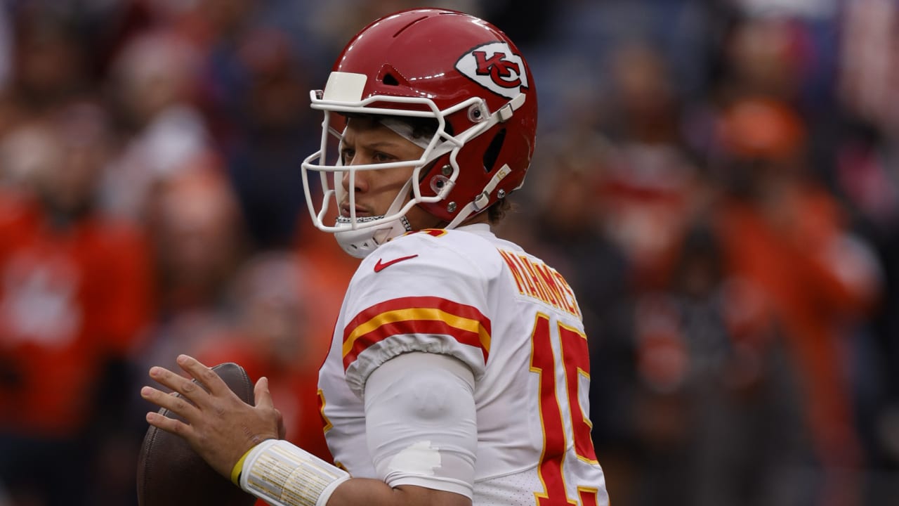 Kansas City Chiefs quarterback Patrick Mahomes dodges defender for ...