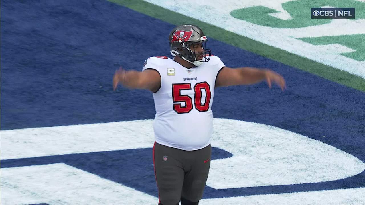 Tampa Bay Buccaneers running back Sean Tucker follows nose tackle Vita ...