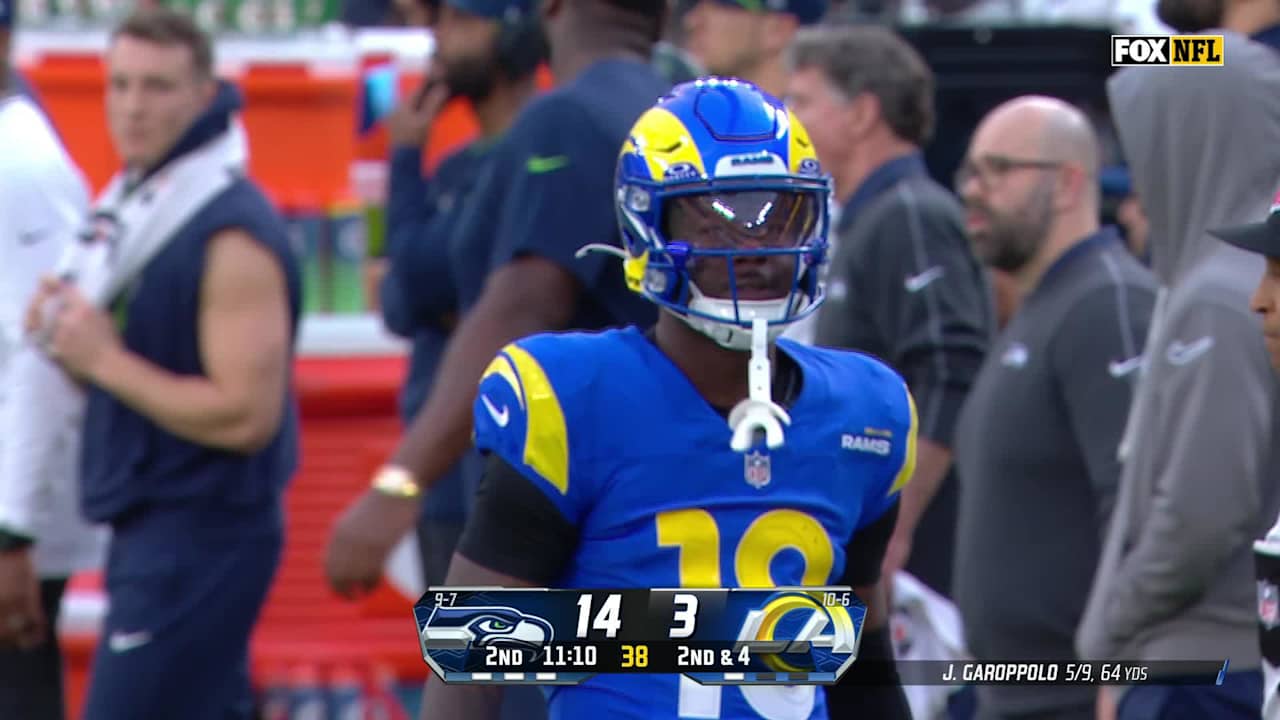 Los Angeles Rams wide receiver Tyler Johnson averts a loss of yardage ...