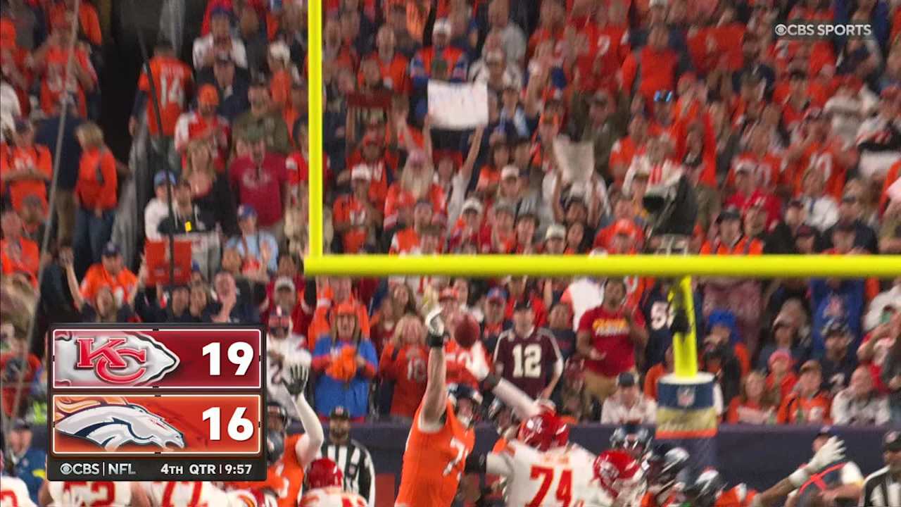 Denver Broncos offensive Frank Crum leaps up to block Kansas City ...