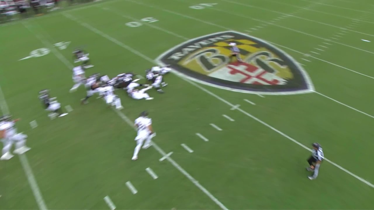 Baltimore Ravens center Ben Cleveland's snap goes flying into another ...