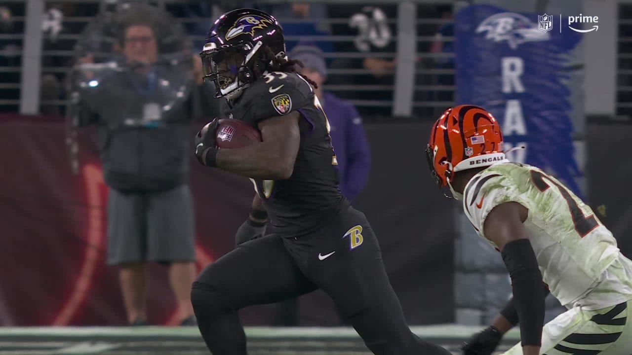 Baltimore Ravens running back Gus Edwards cuts back and accelerates for ...