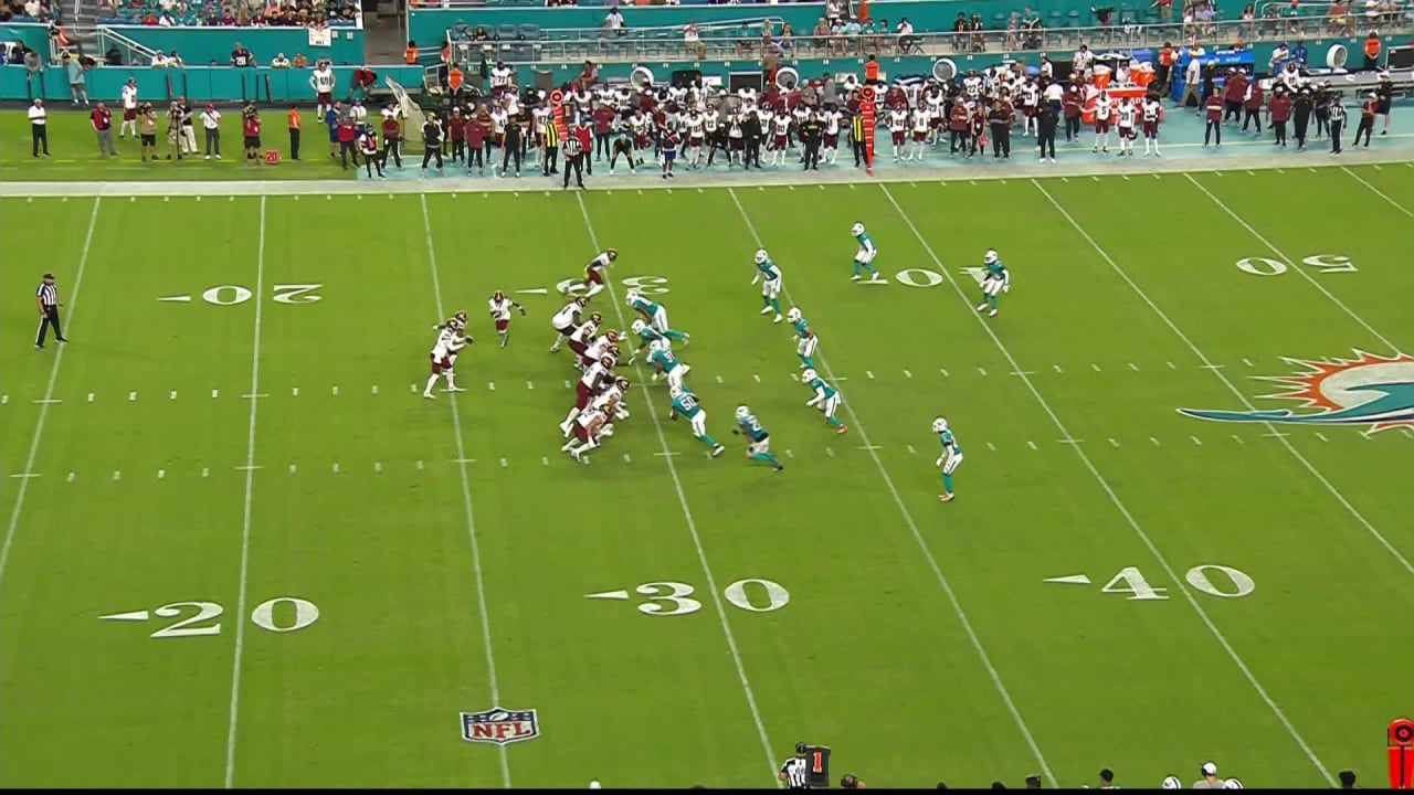 Washington Commanders quarterback Jeff Driskel leaves defenders in the ...