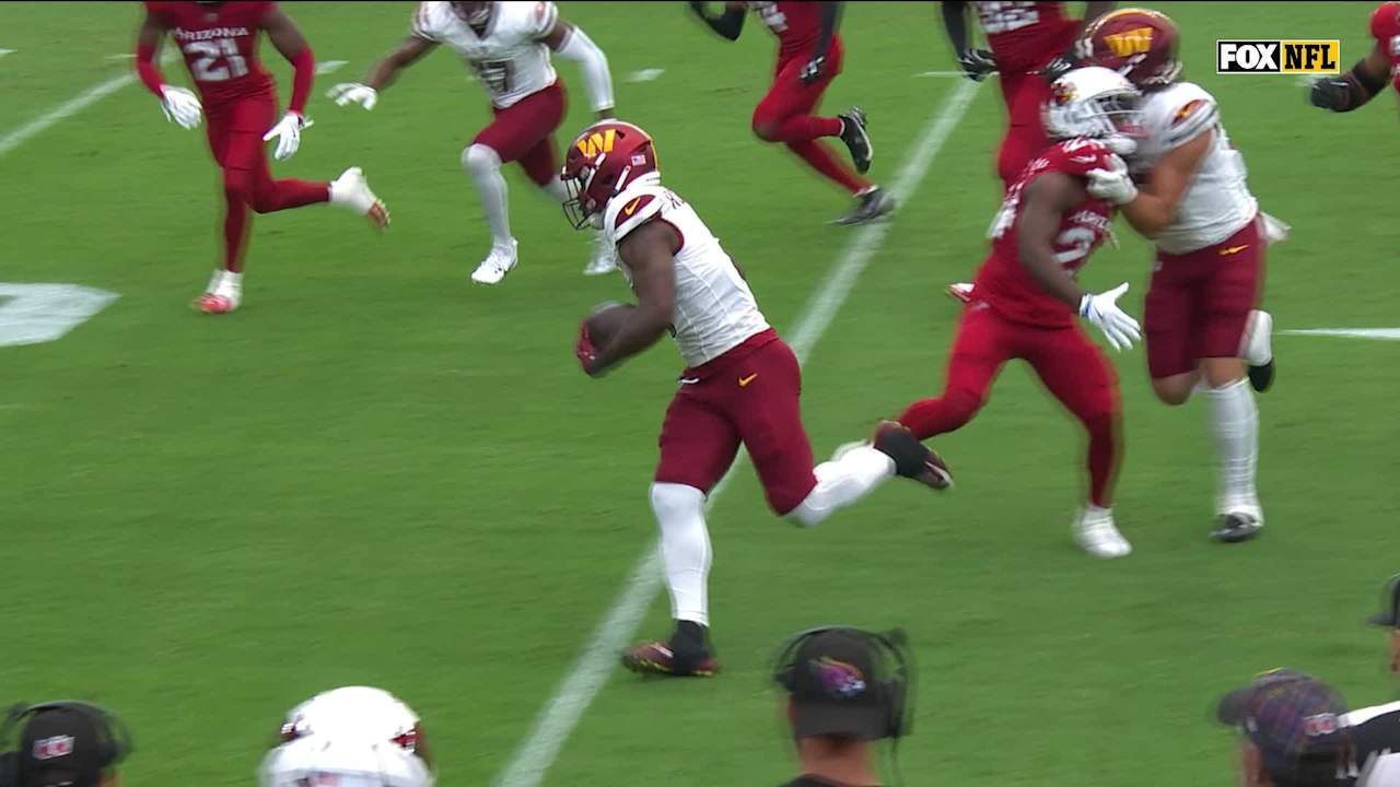 Washington Commanders running back Brian Robinson Jr. moves chains with ...
